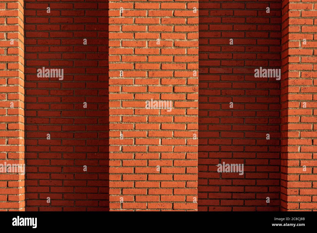 Red brick wall in sunlight Stock Photo - Alamy