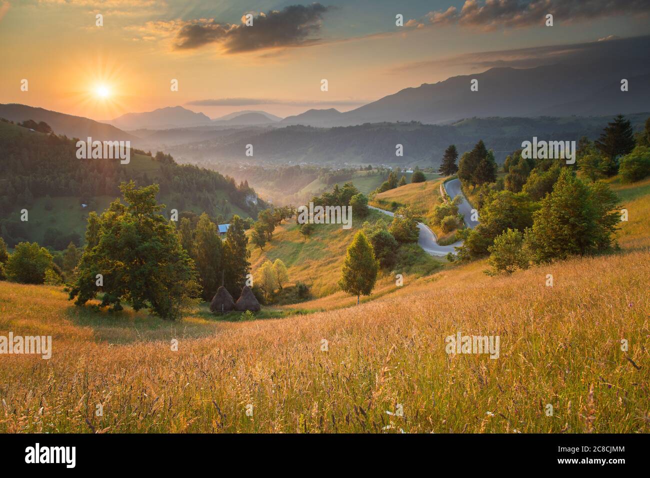 Summer sunrise in the Transylvanian village. Aerial foggy landscape in ...