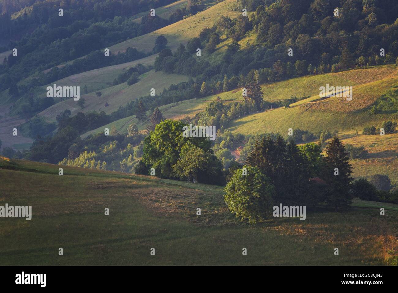 Summer sunrise in the Transylvanian village. Aerial foggy landscape in ...