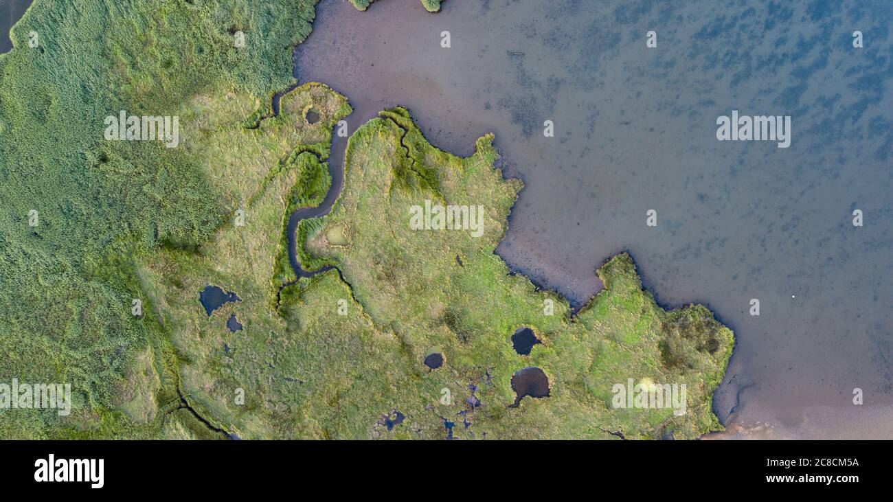 Drone top down bird's eye view landscape image of tidal wetlands in ...