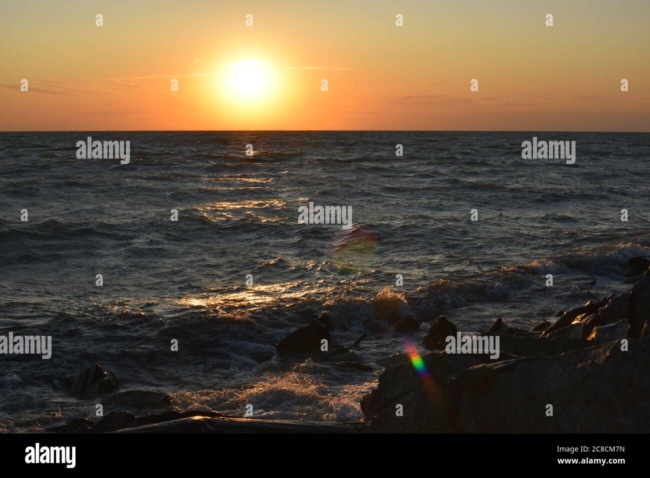 Setting sun on waves hi-res stock photography and images - Alamy