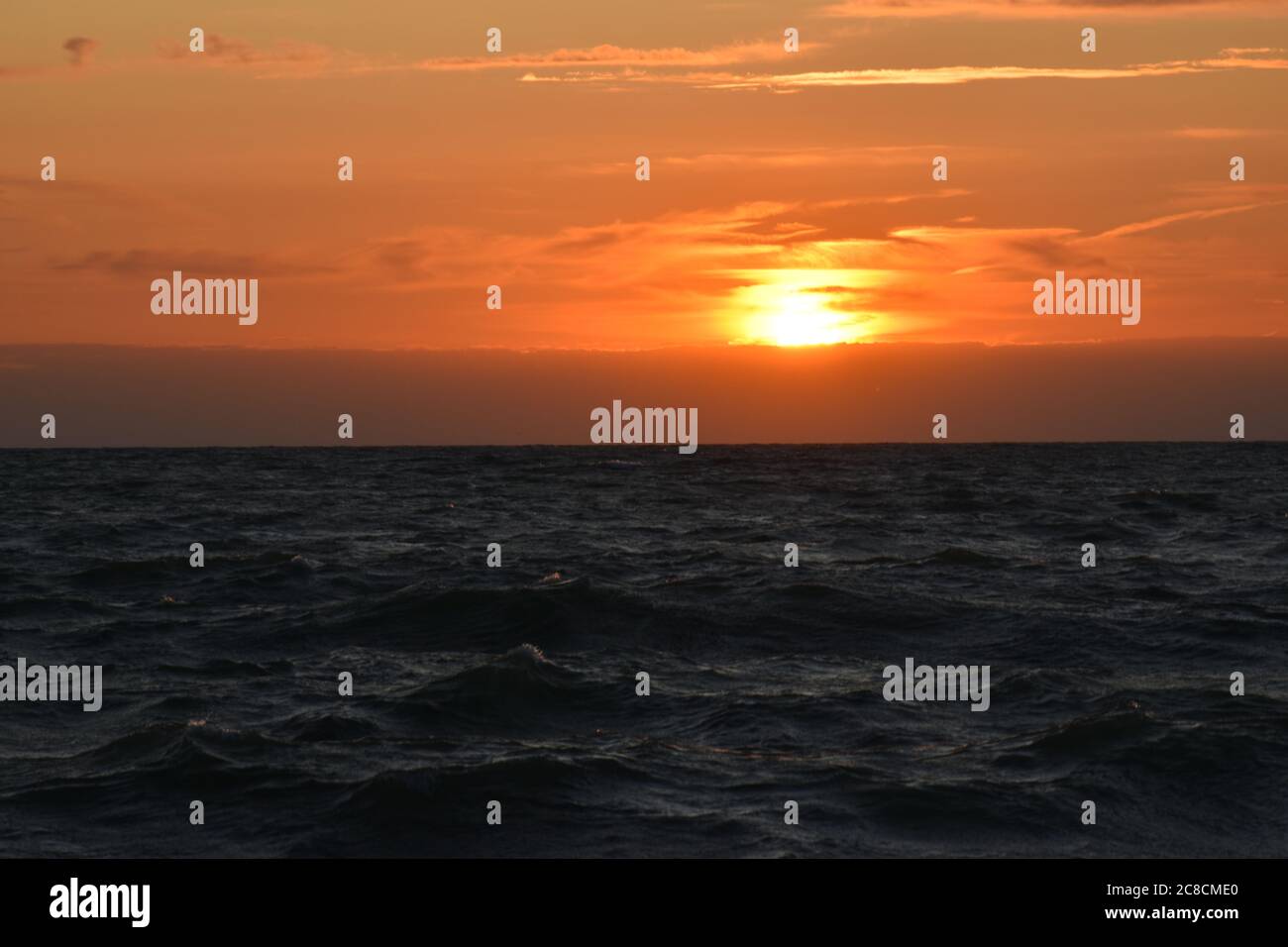 Sunset at the beach Stock Photo - Alamy