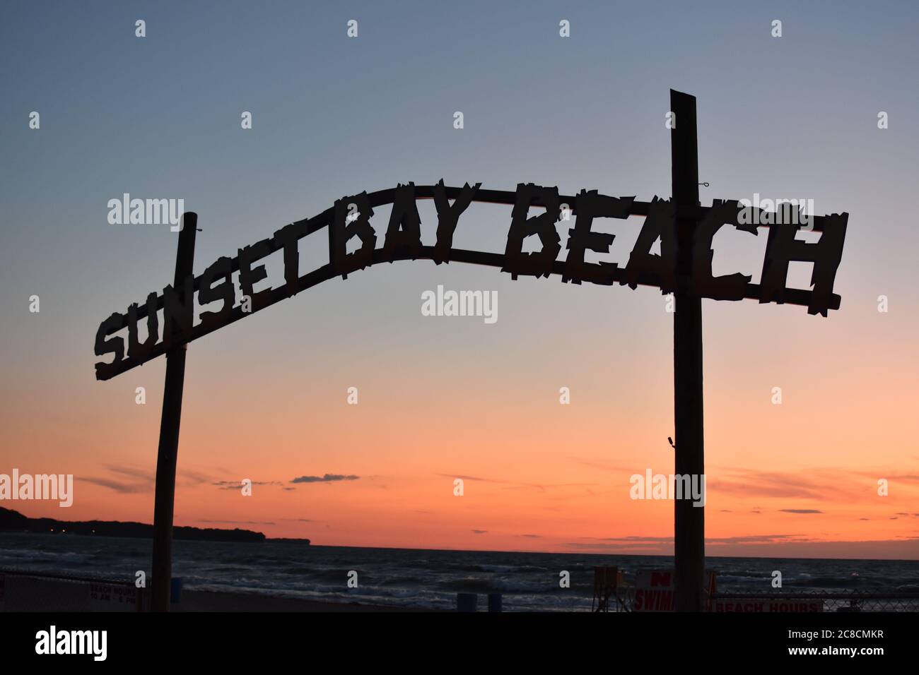 Sunset Bay Beach sign Stock Photo - Alamy