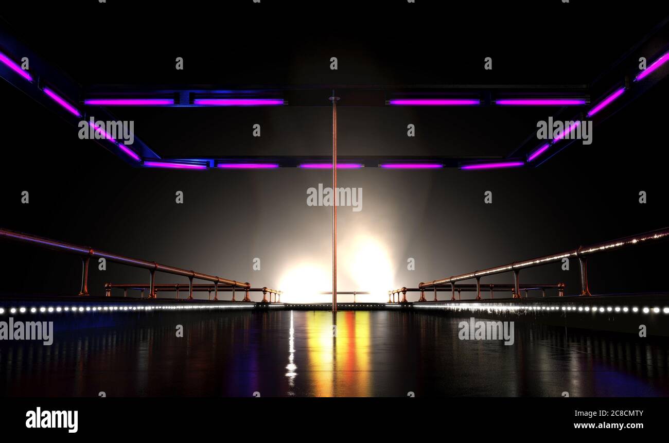 An empty strip club dancing stage with a pole and brass railings and ...