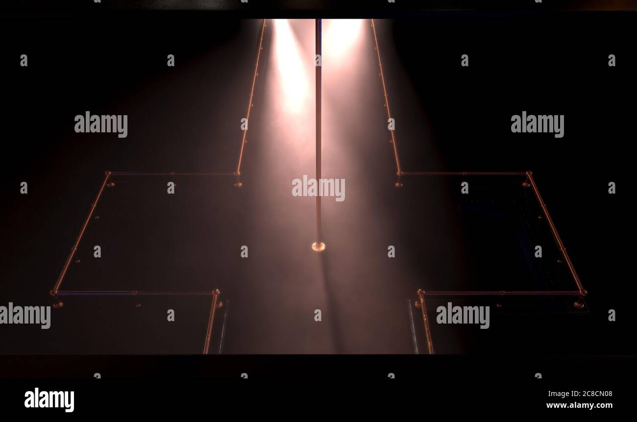 An empty strip club dancing stage with a pole and brass railings and ...