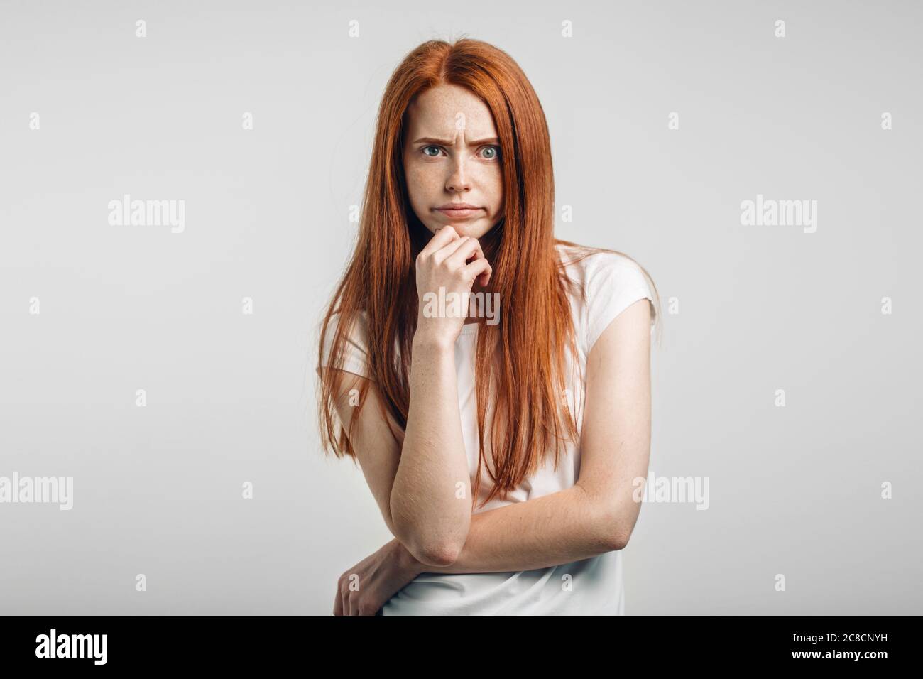 annoyed female with freckles and pursed lips having disappointed ...