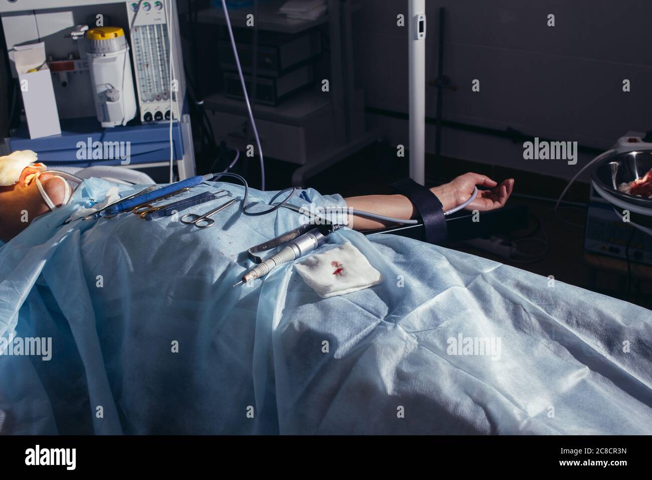 Surgeon performing cosmetic surgery on nose in hospital operating room ...