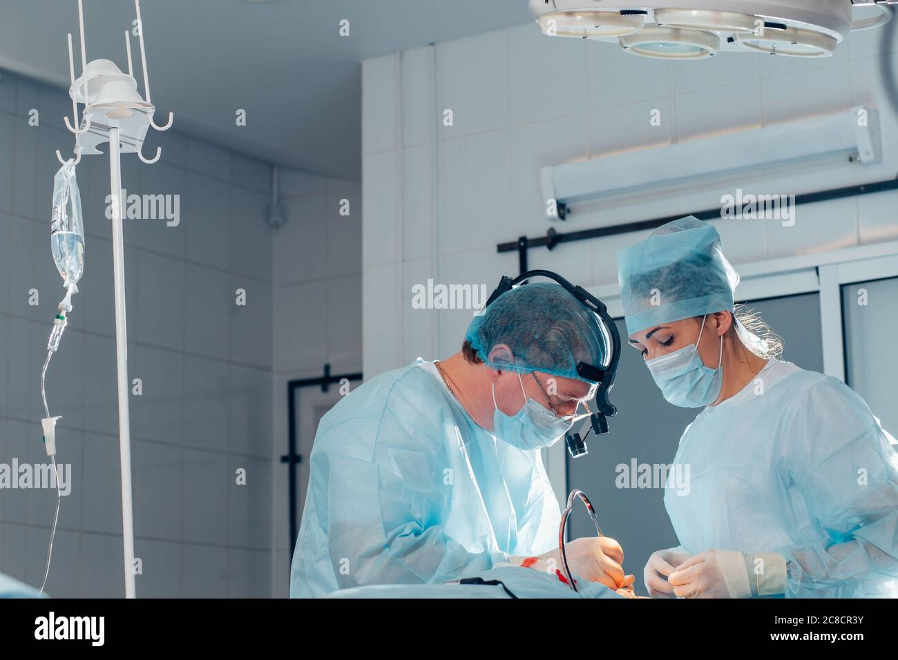 surgery, healthcare, medicine and people concept - group of surgeons at ...