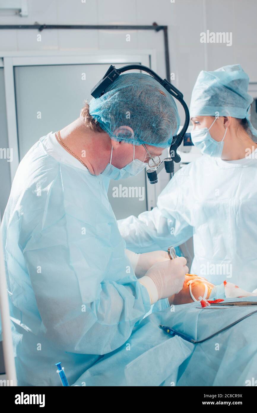 Surgery team doing plastic surgery on nose in a surgical room Stock ...