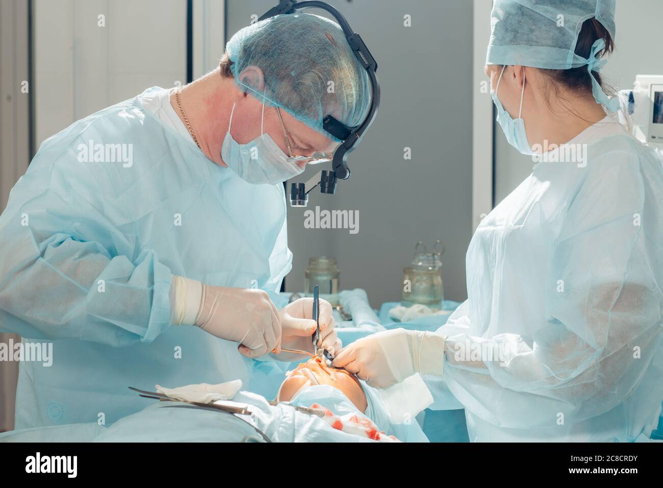 surgery, healthcare, medicine and people concept - group of surgeons at ...