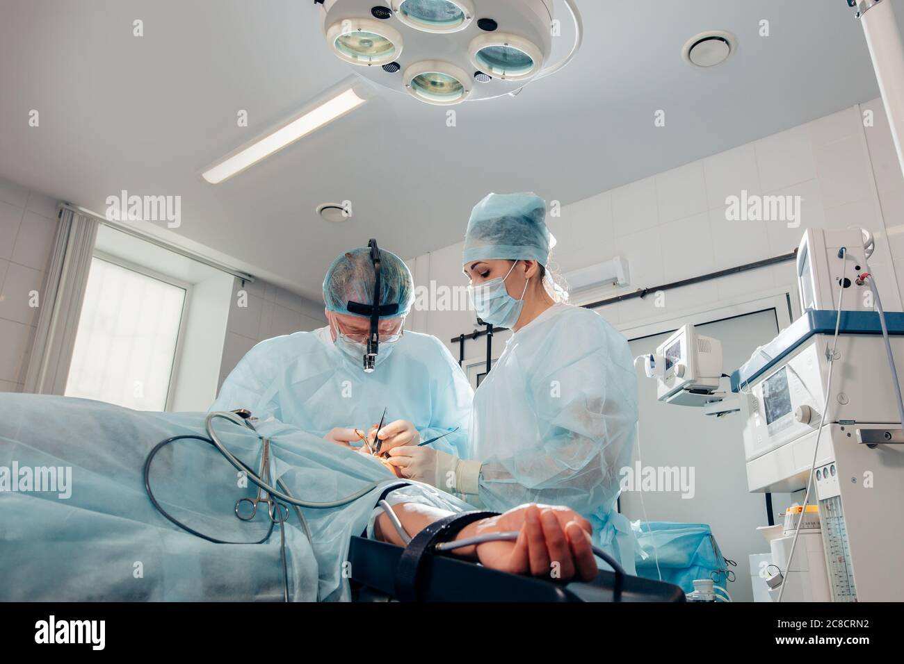 patient lies on the operating surgical table during rhinoplastic ...