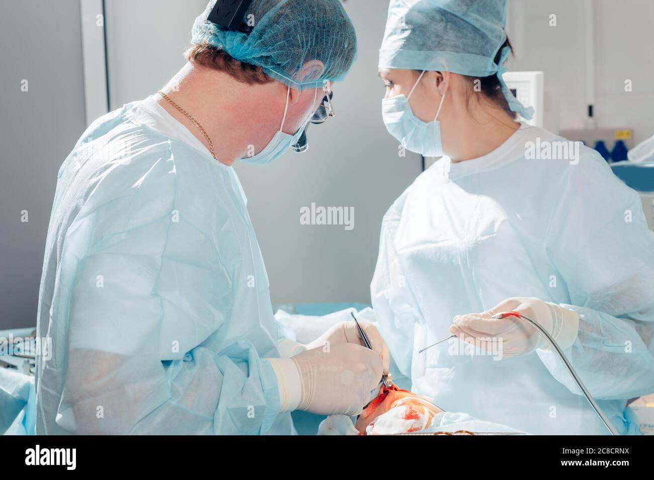 surgery, healthcare, medicine and people concept - group of surgeons at ...