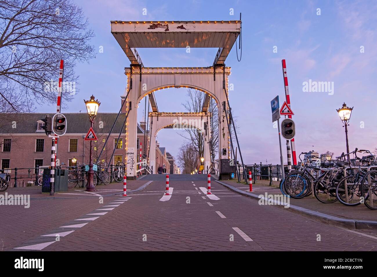 Medieval drawbridge in Amsterdam Netherlands at sunset Stock Photo - Alamy