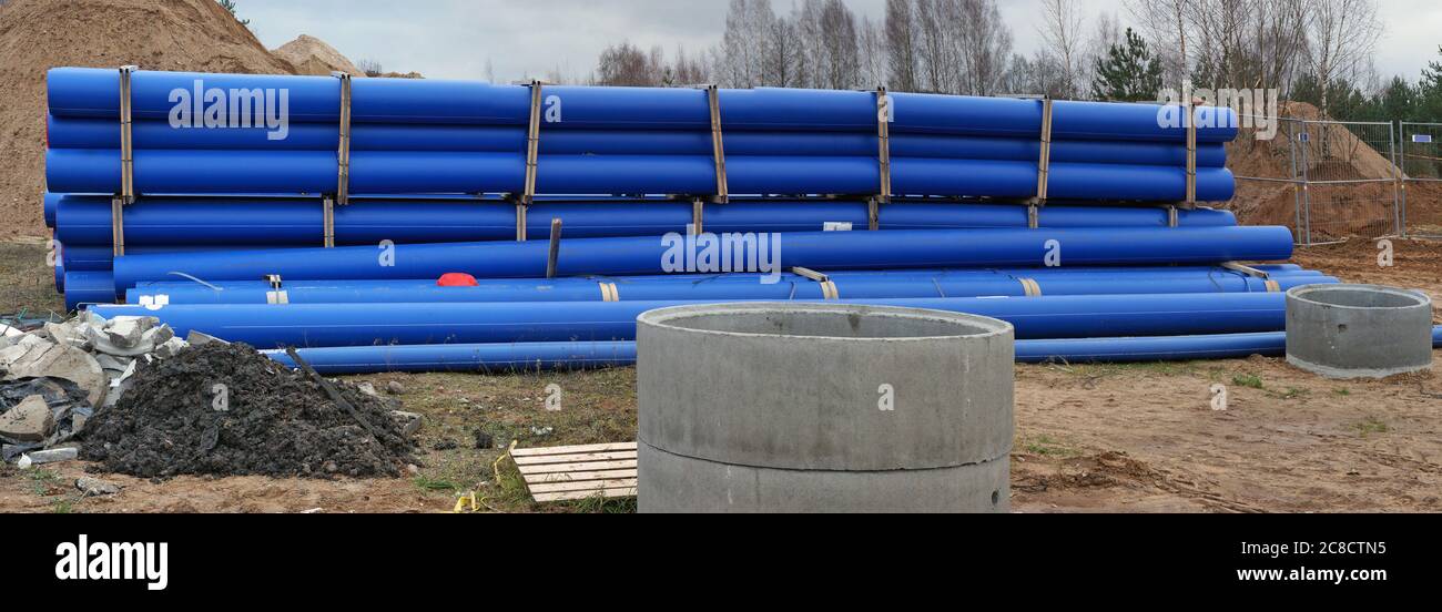 Long blue plastic pipes for the restoration of the old decayed sewage ...
