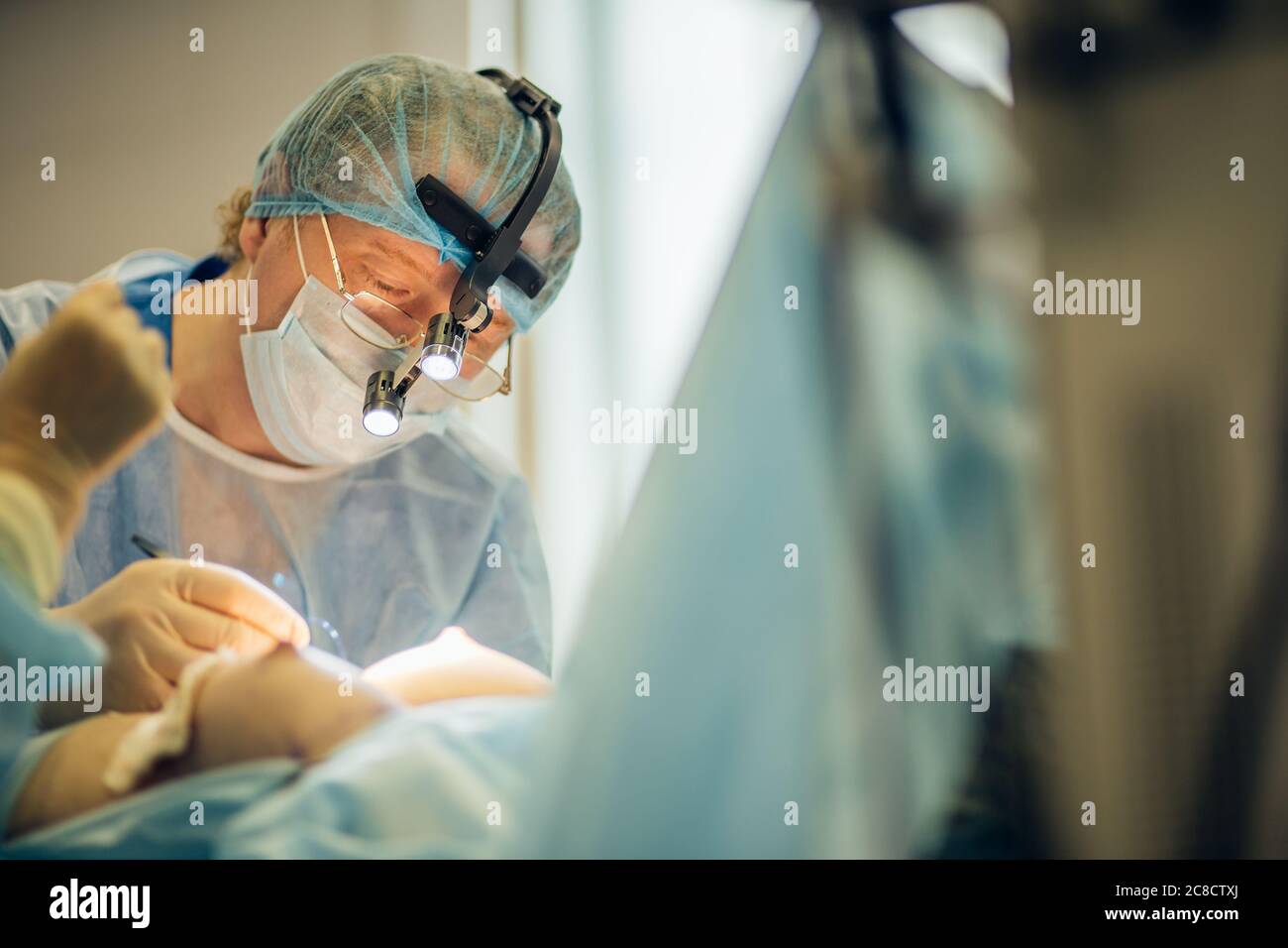 Stitching the patient's skin, the self-extracting threads, after ...