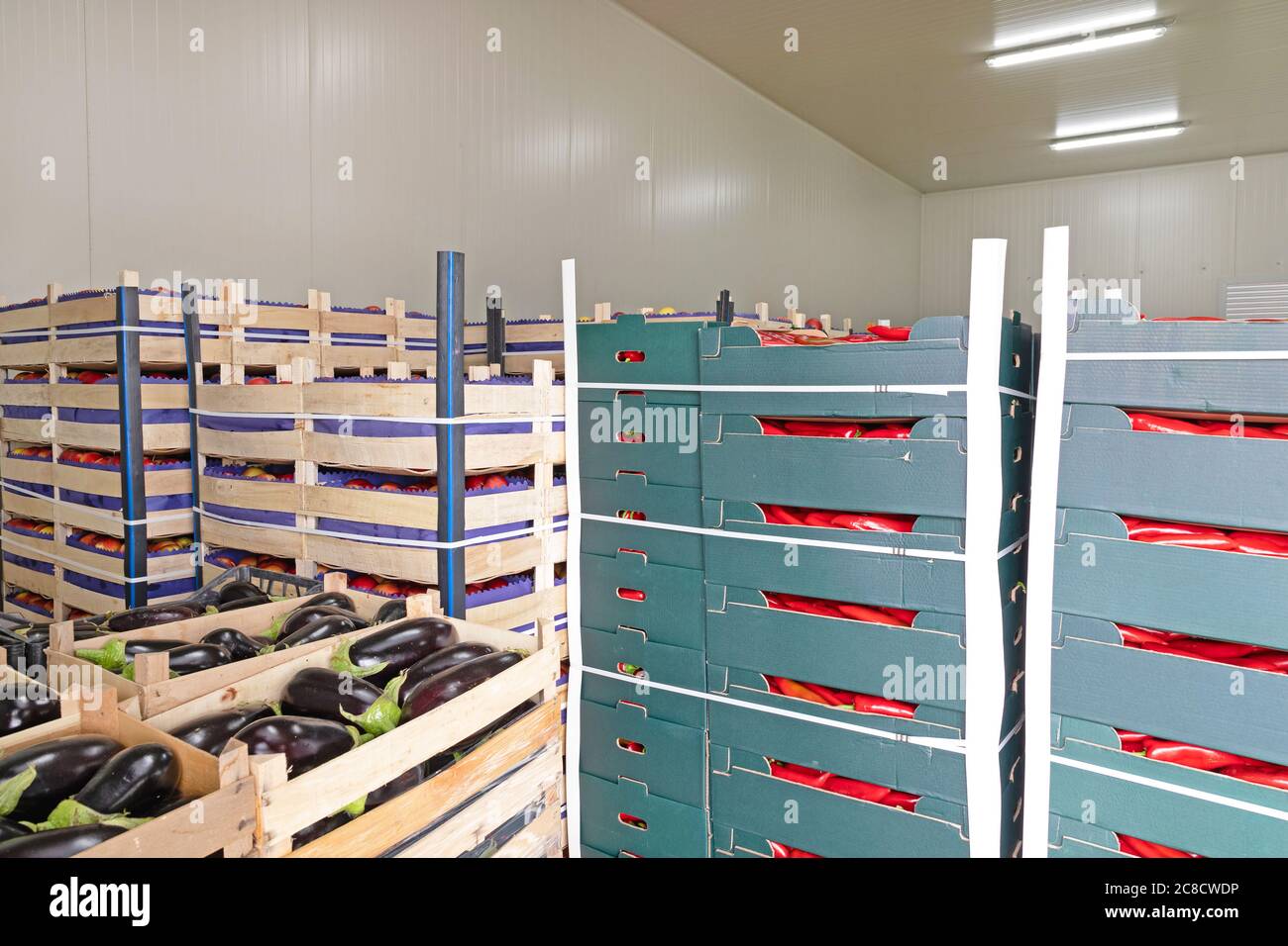 Crates of Produce at Pallets in Storage Warehouse Stock Photo - Alamy