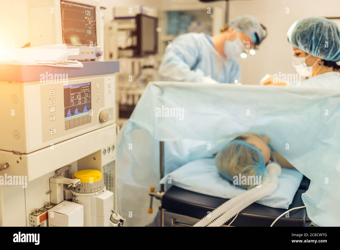 surgery, healthcare, medicine and people concept - nurse assisting ...