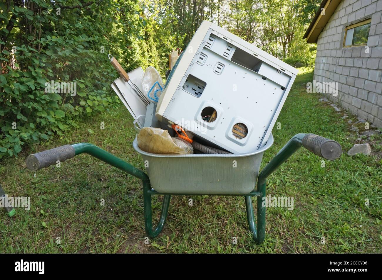 Great cleaning in a country house. Old rubbish and computer are taken ...