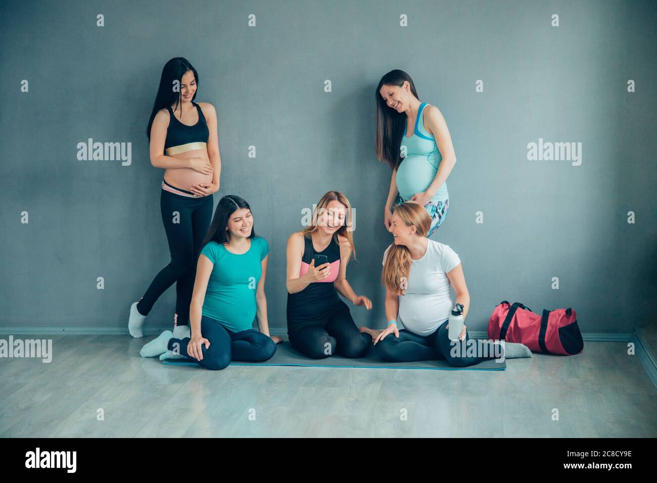 pregnancy, sport, fitness, people and healthy lifestyle concept - group ...