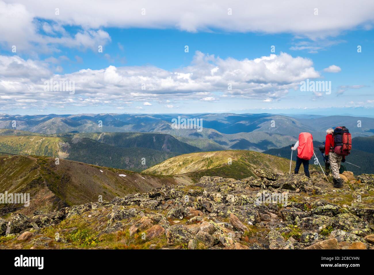 Happy travelers, having reached the summit, life goal, success, freedom ...