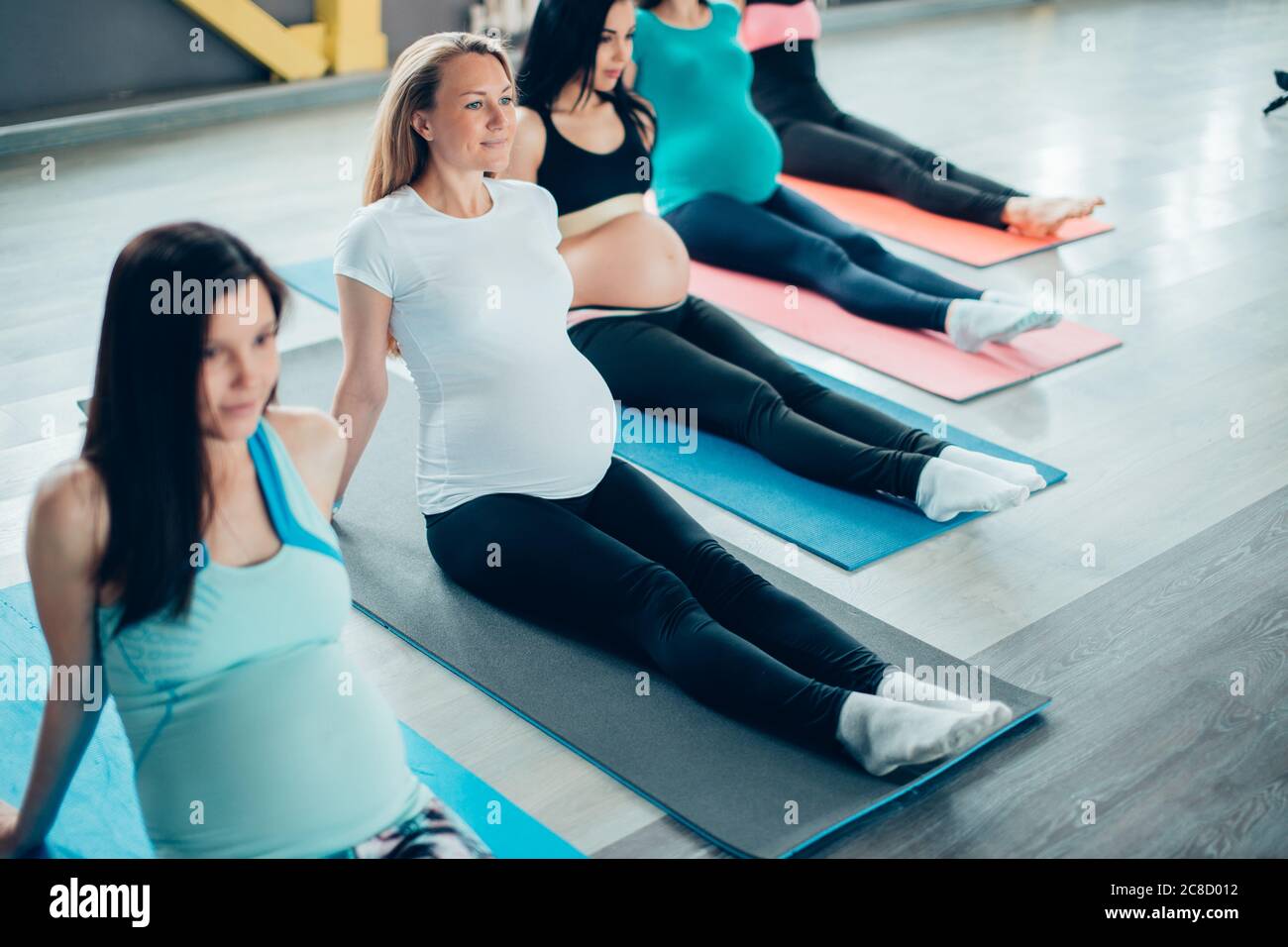 pregnancy, sport, fitness, people and healthy lifestyle concept - group ...