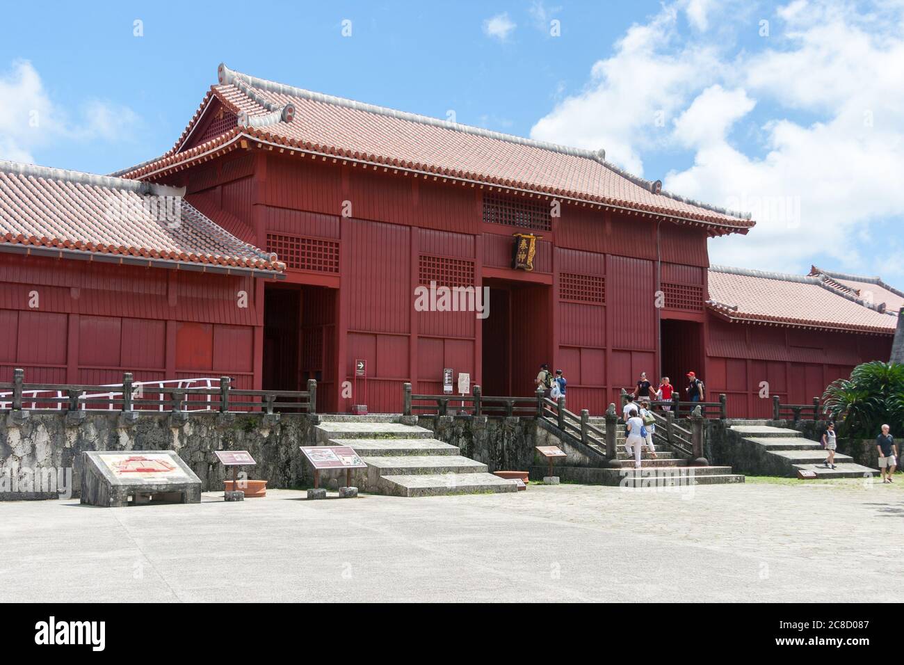 Red building in Naha, Japan under blue sky and white clouds Stock Photo ...