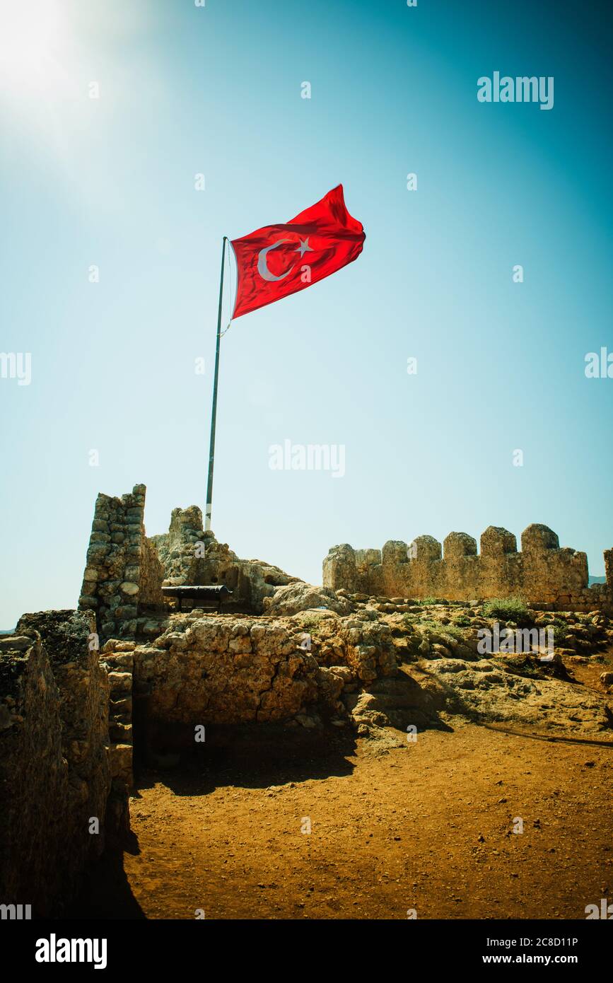 Turkish flag flying on top of the Byzantine castle in the town of ...