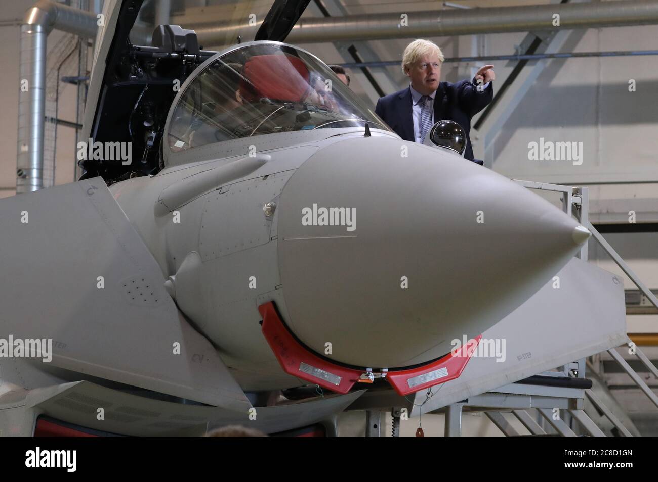 Prime Minister Boris Johnson looks at a Typhoon fighter jet at RAF ...