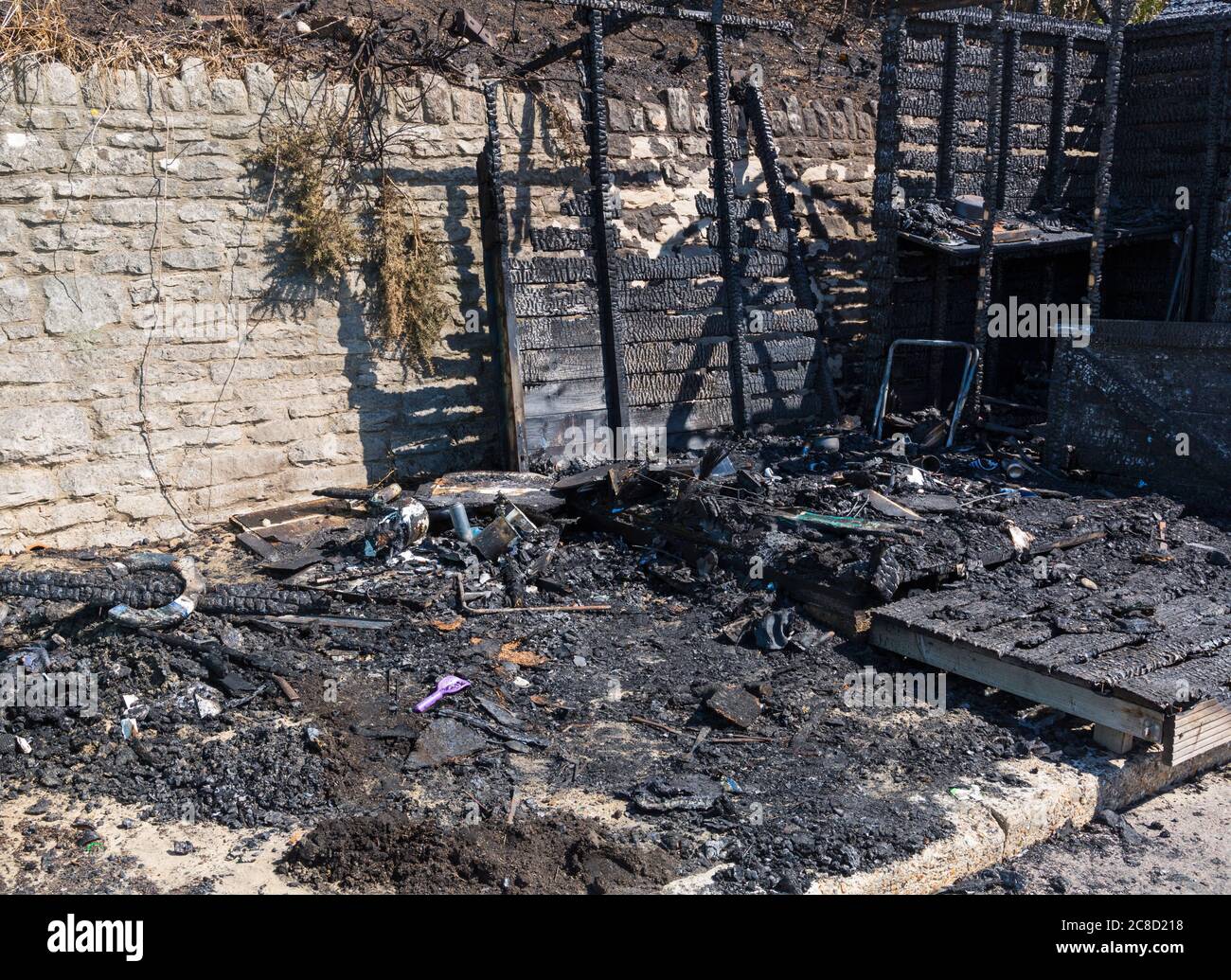 Charred remains of beach huts destroyed in fire at West Cliff beach ...