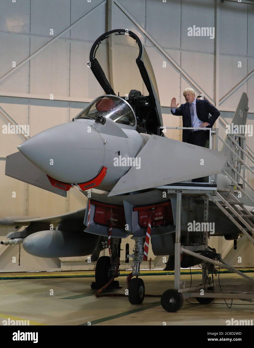 Prime Minister Boris Johnson looks at a Typhoon fighter jet at RAF ...