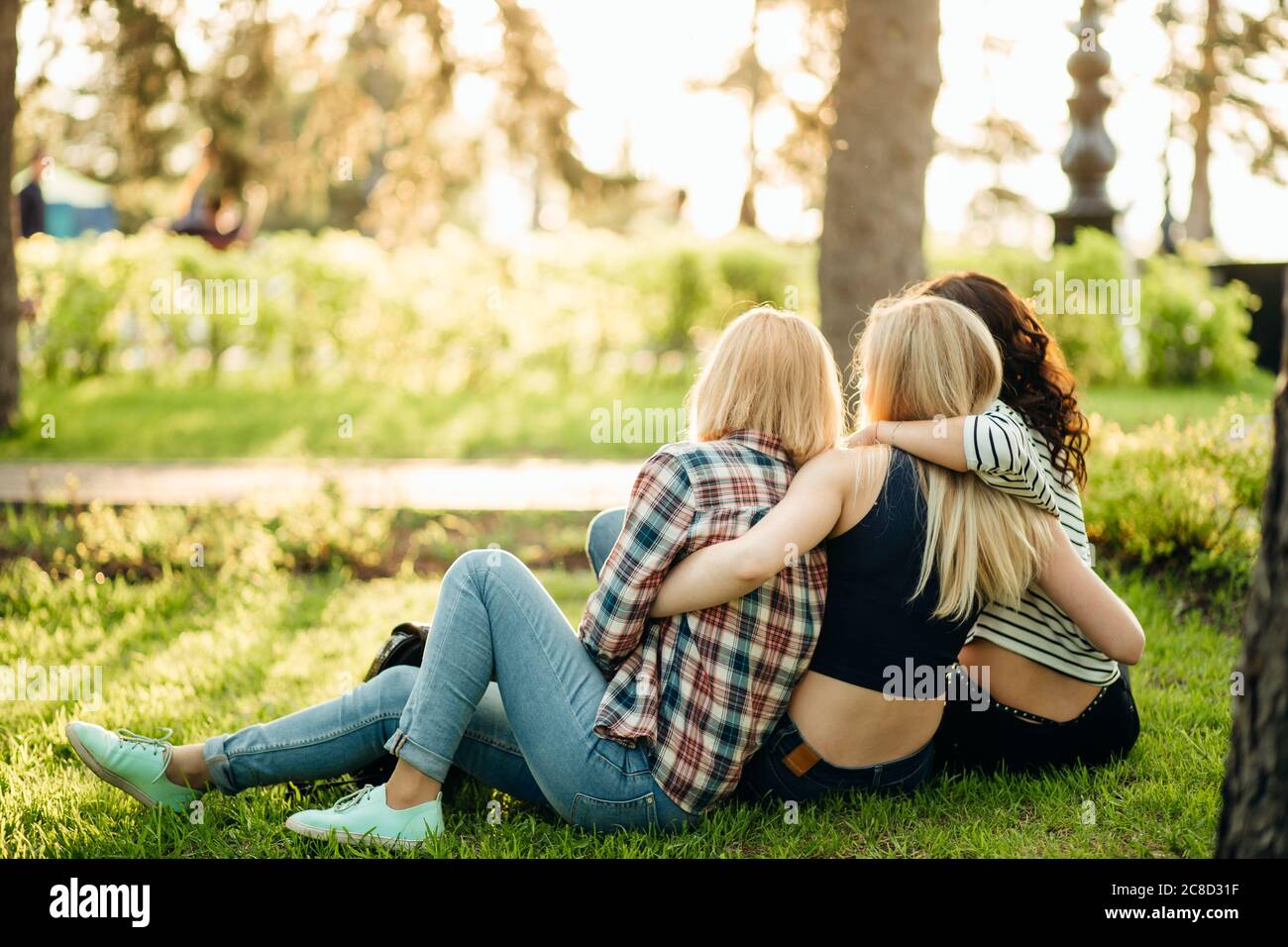 Three people back view hi-res stock photography and images - Alamy