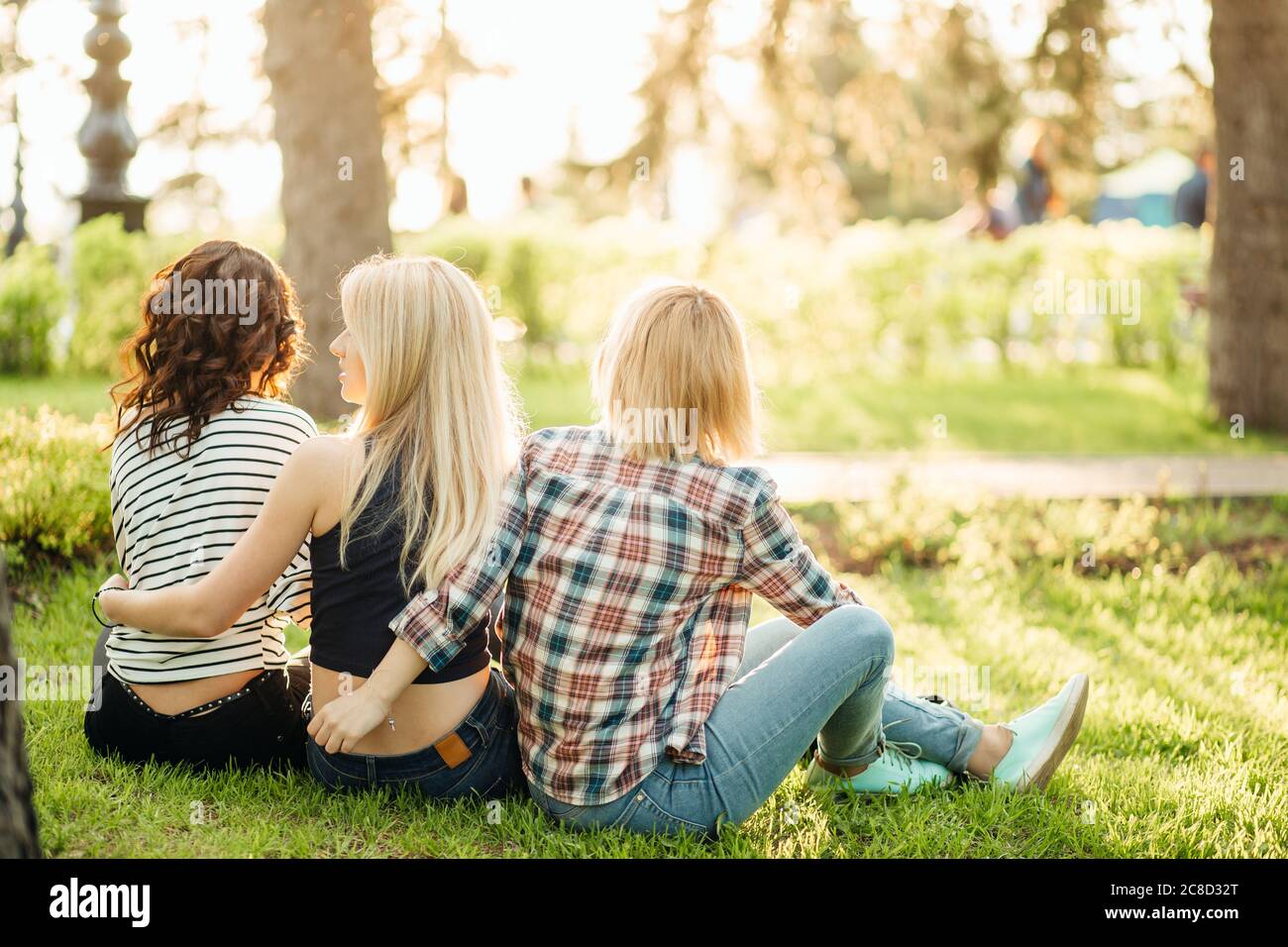 Three people back view hi-res stock photography and images - Alamy