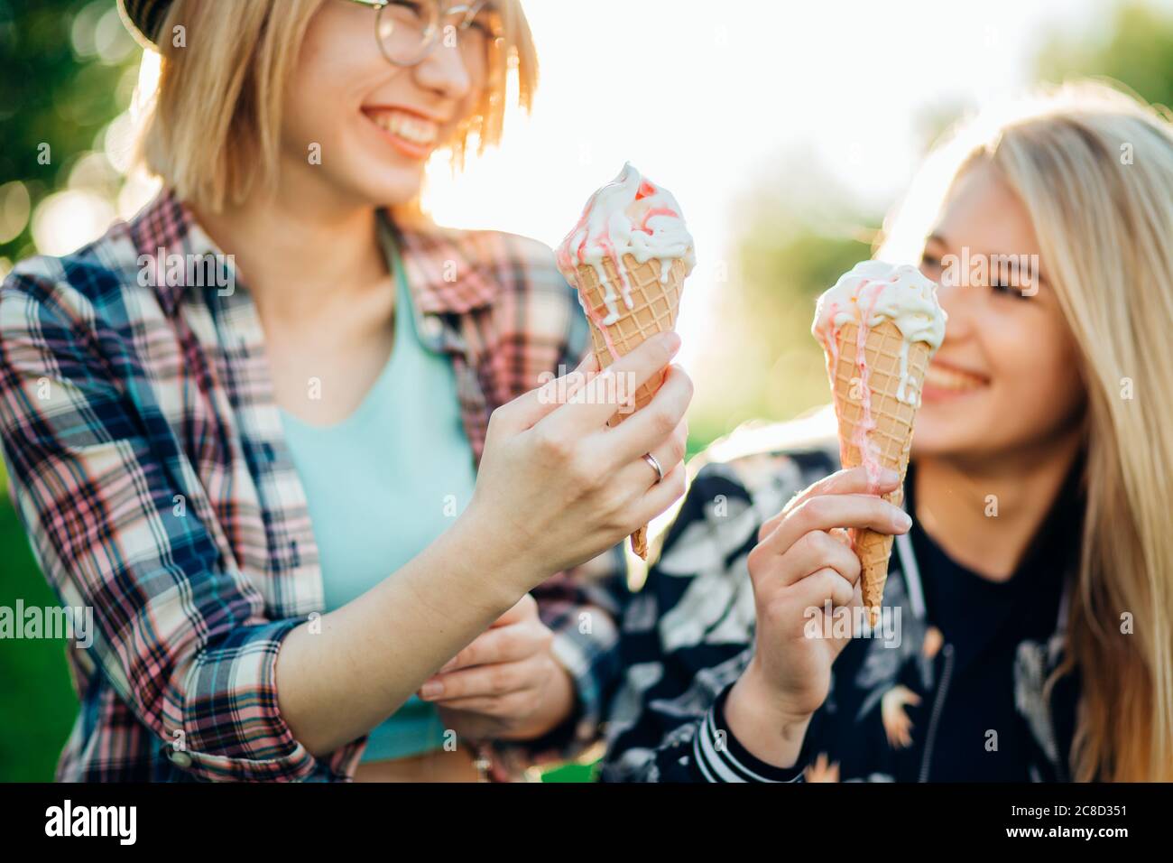Friends, two women with ice cream having fun Stock Photo - Alamy