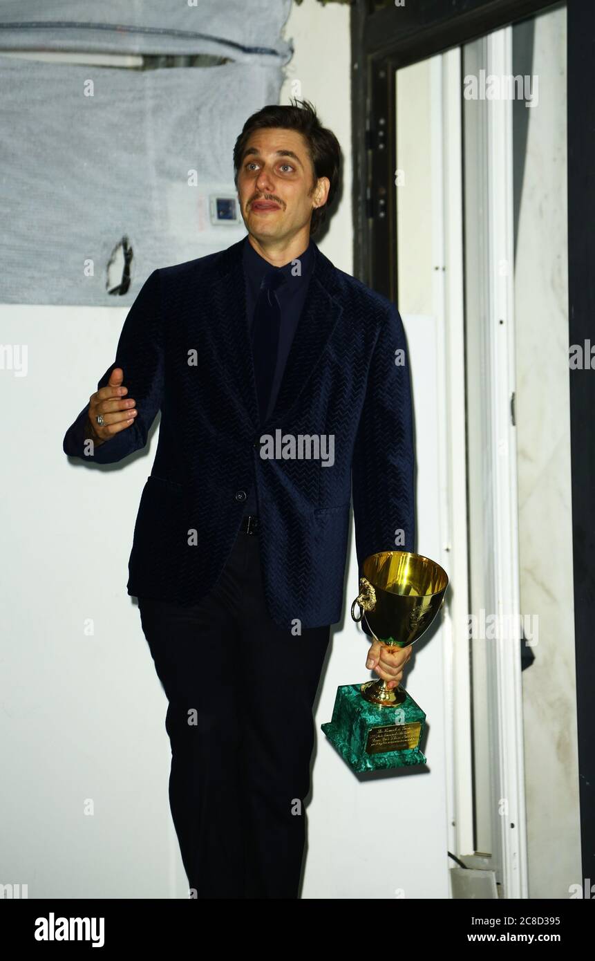 VENICE, ITALY - SEPTEMBER 07: Luca Marinelli poses withthe Coppa Volpi ...