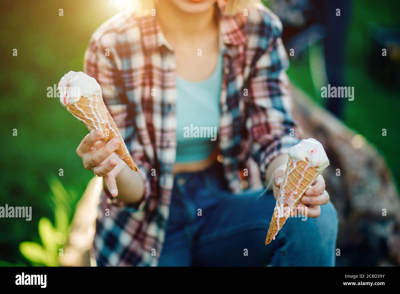 Happy girl eating ice cream and having fun. focus on ice cream Stock ...