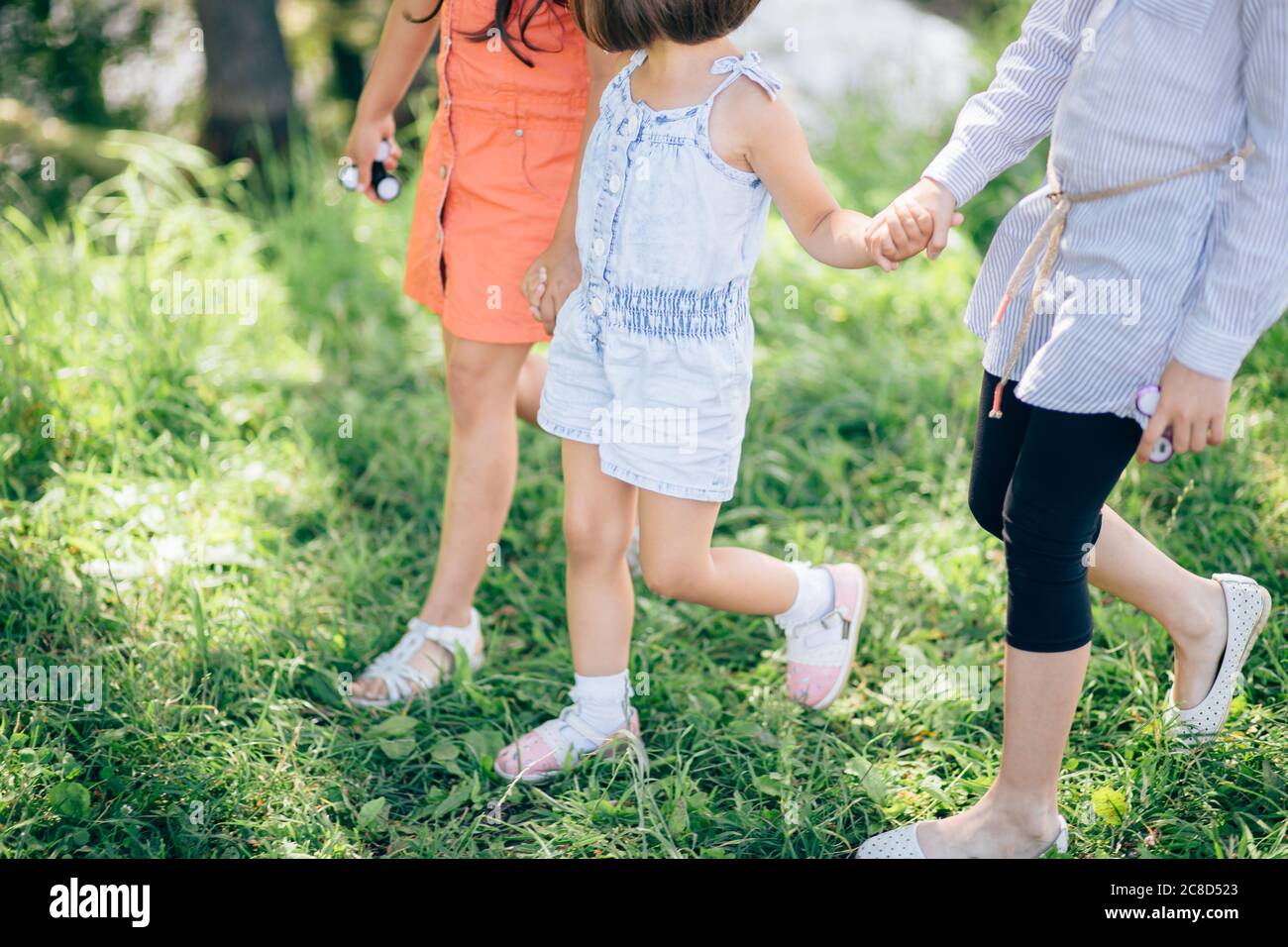 Happy children having fun in spring park Stock Photo - Alamy