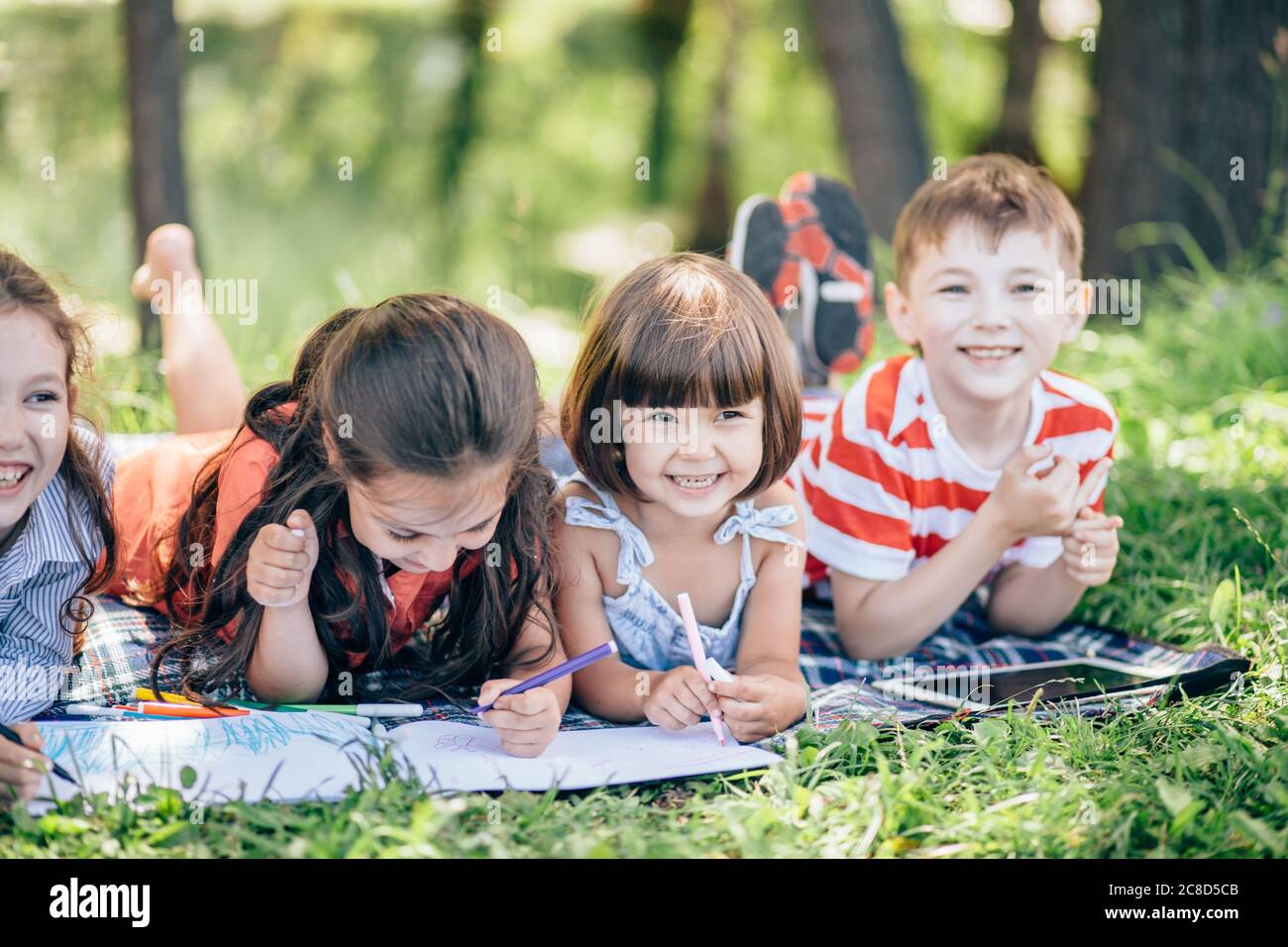 Happy kids doing arts and crafts hi-res stock photography and images ...