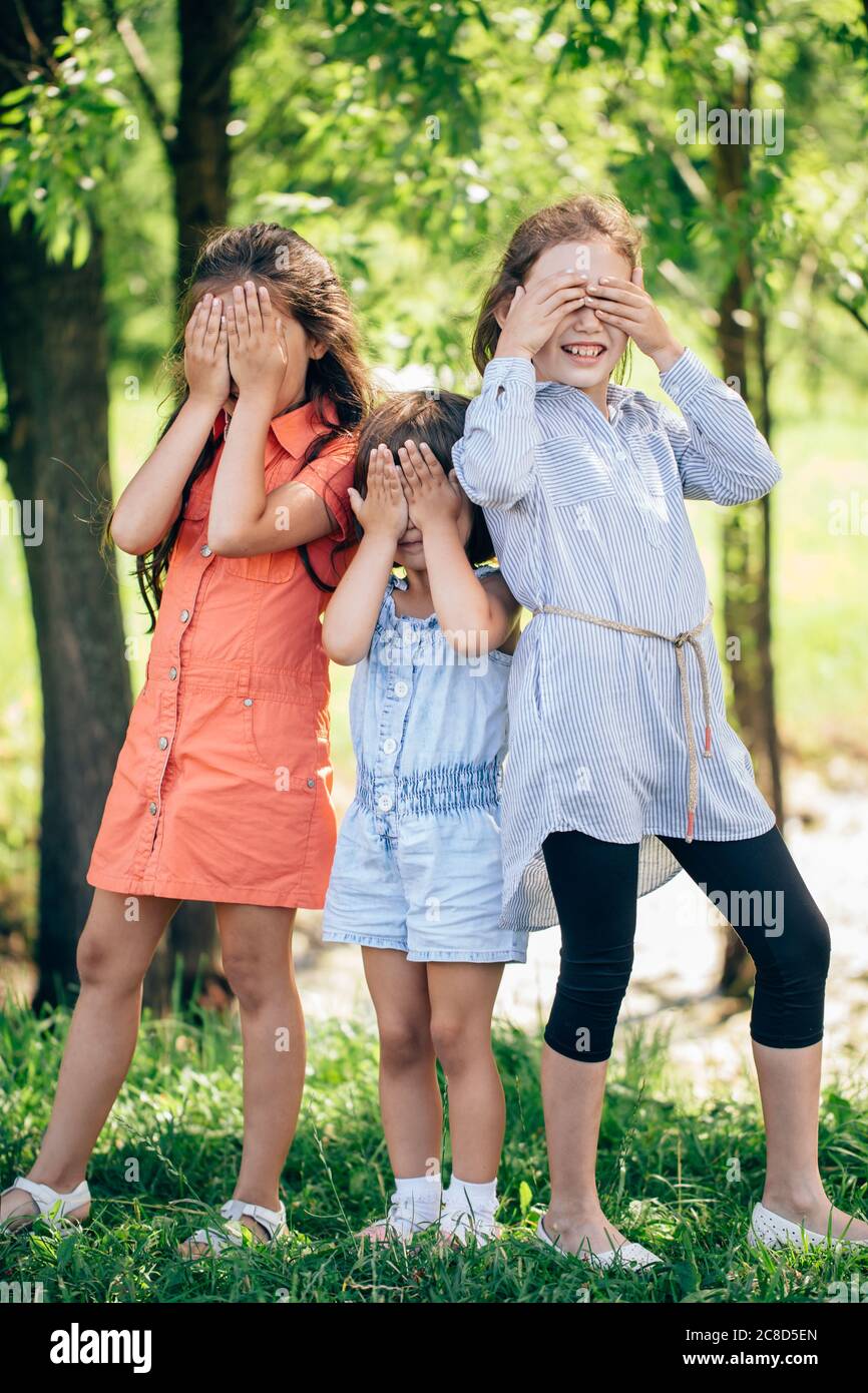 Happy children having fun in spring park Stock Photo - Alamy