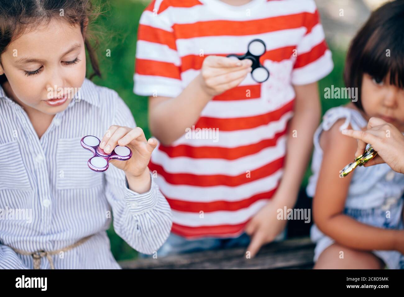 Child Playing With Fidget Spinner High Resolution Stock Photography and ...