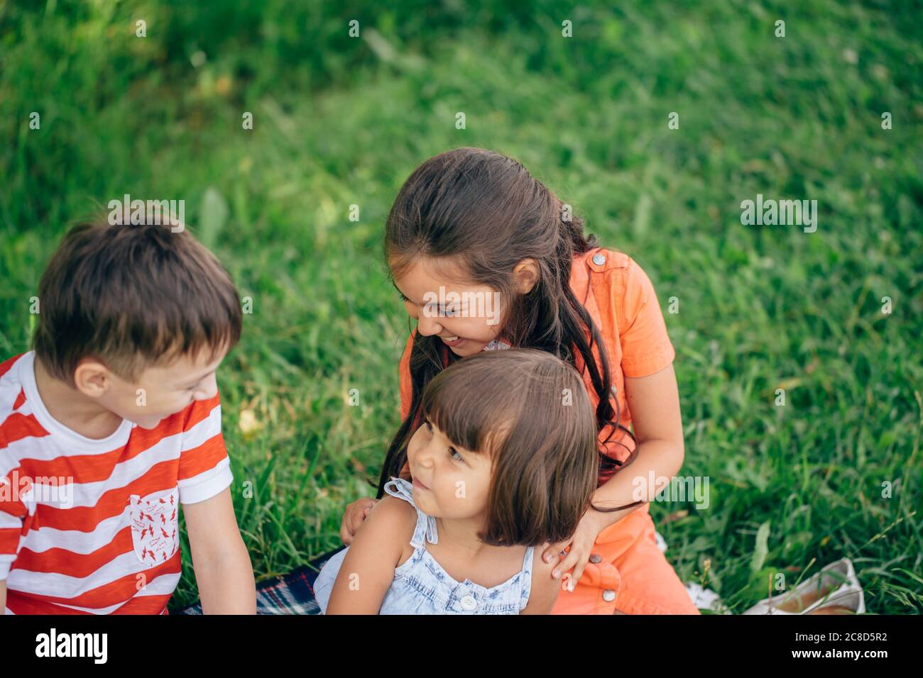 Group of happy smiling friends playing outdoors in spring park Stock ...