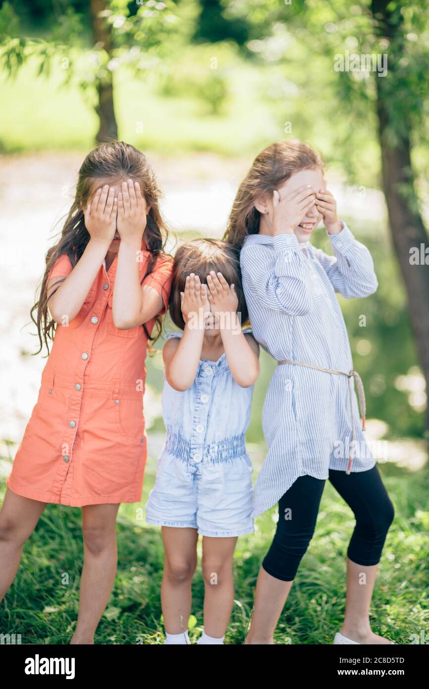 Happy children having fun in spring park Stock Photo - Alamy