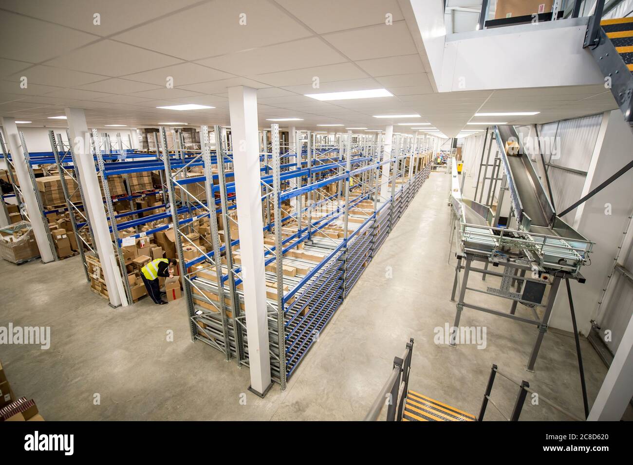Rows of shelves and product containment in a warehouse distribution ...