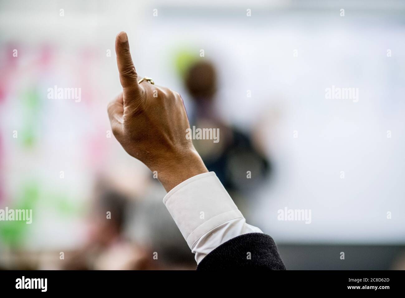 Meeting speaker hands raised hi-res stock photography and images - Alamy