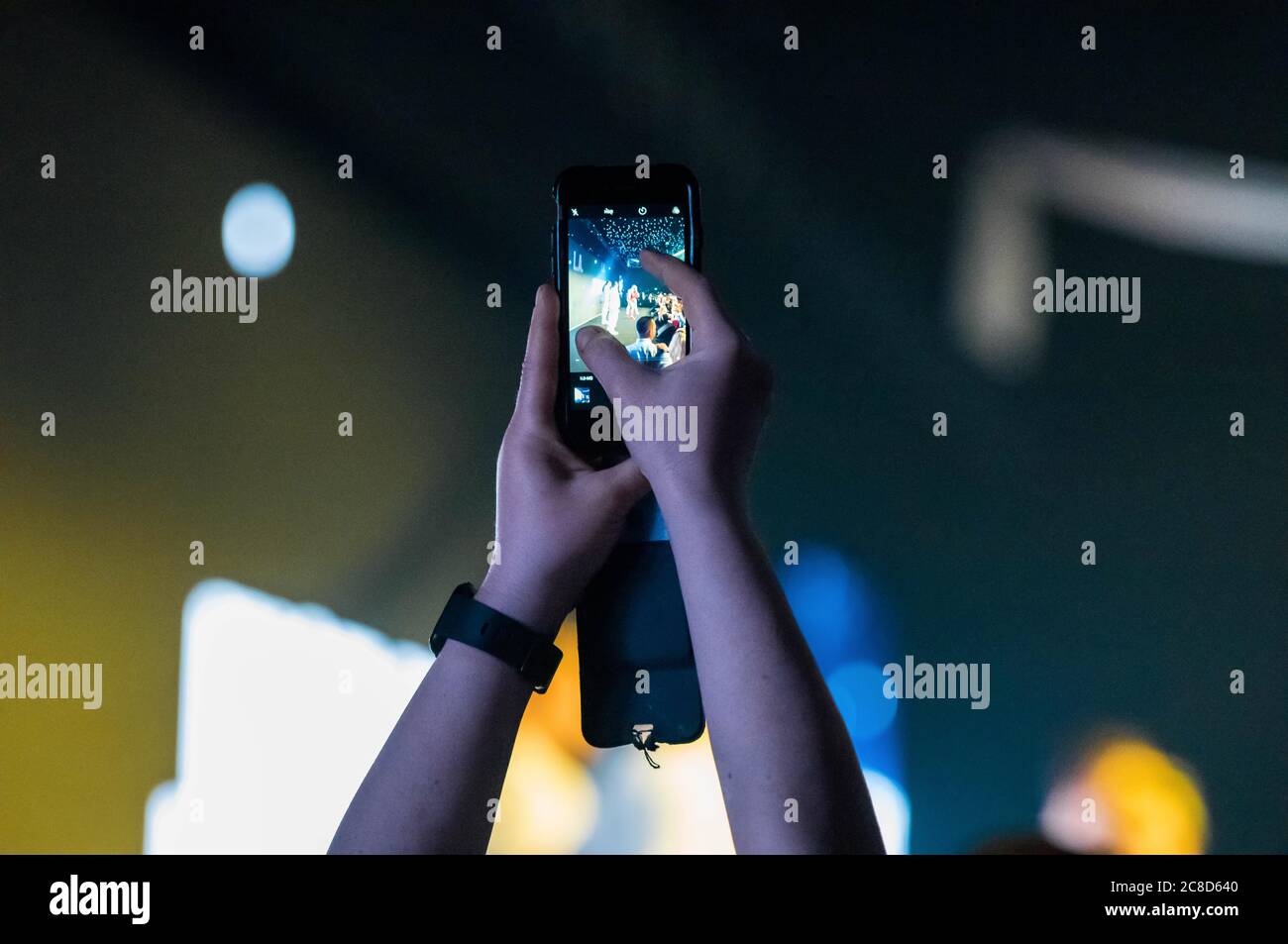 Capturing a Stage Performance With a Smart Phone Camera Stock Photo - Alamy