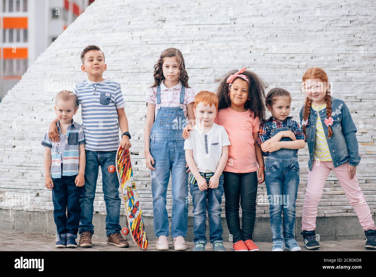 Group of kids looking in the camera posing outdoors. full length. the ...