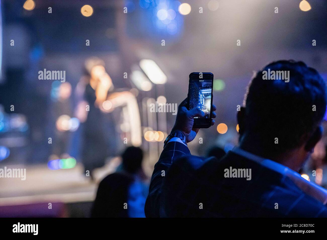 Filming An Event With A Smartphone Stock Photo - Alamy