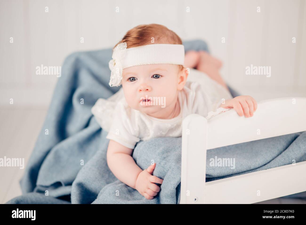 baby in bed. New born child under a blue knitted blanket.Bedding for ...