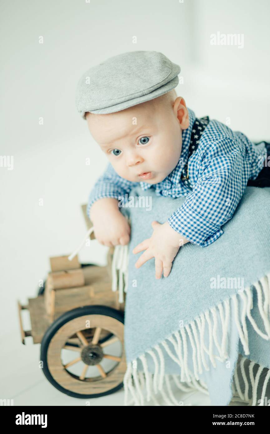 little child baby smiling lying in car bed Stock Photo - Alamy