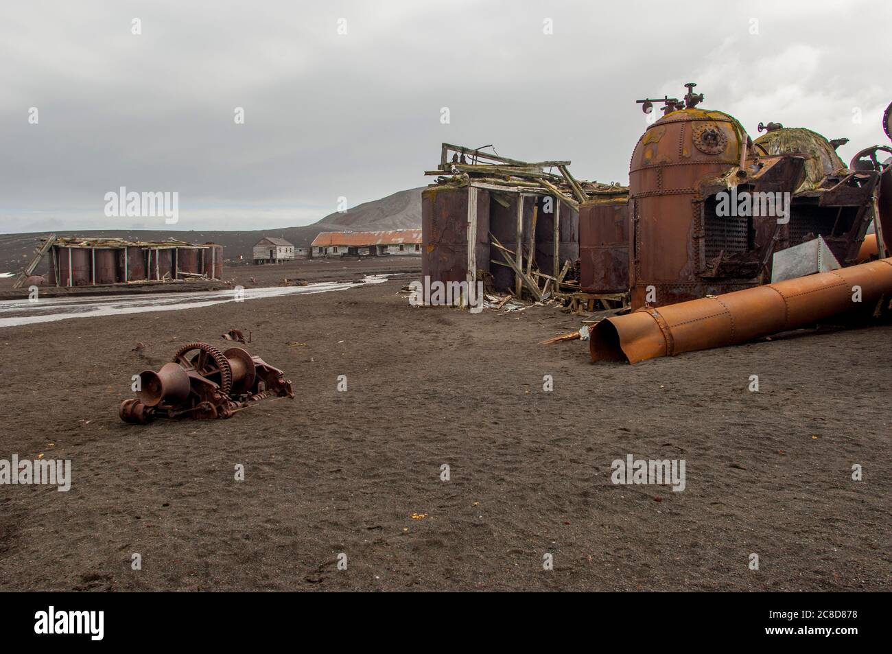 The rusty remains of an old whaling station at Whalers Bay, inside Port ...