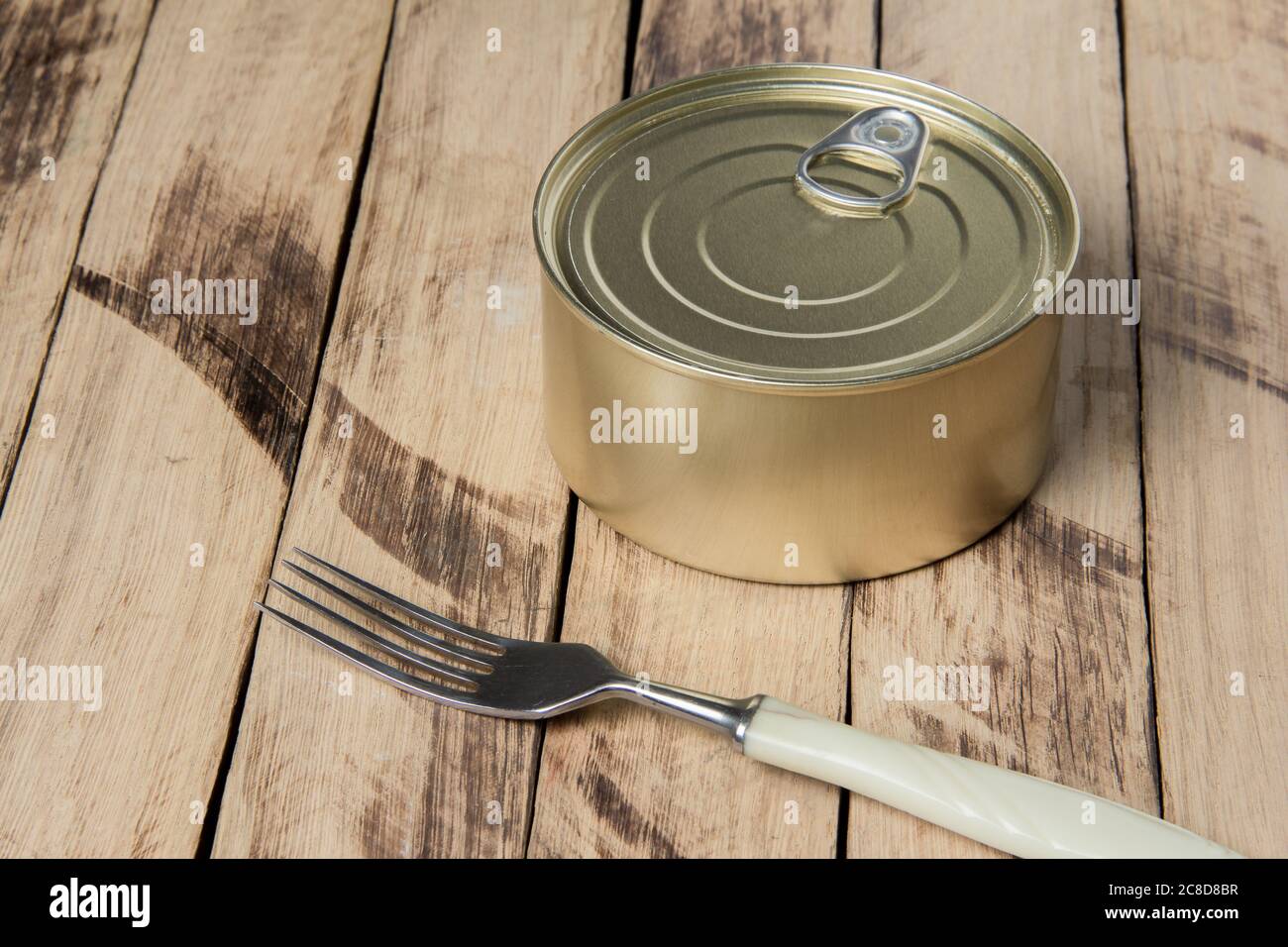 Tin can for food on wooden background. Packaging, product. Storage of ...